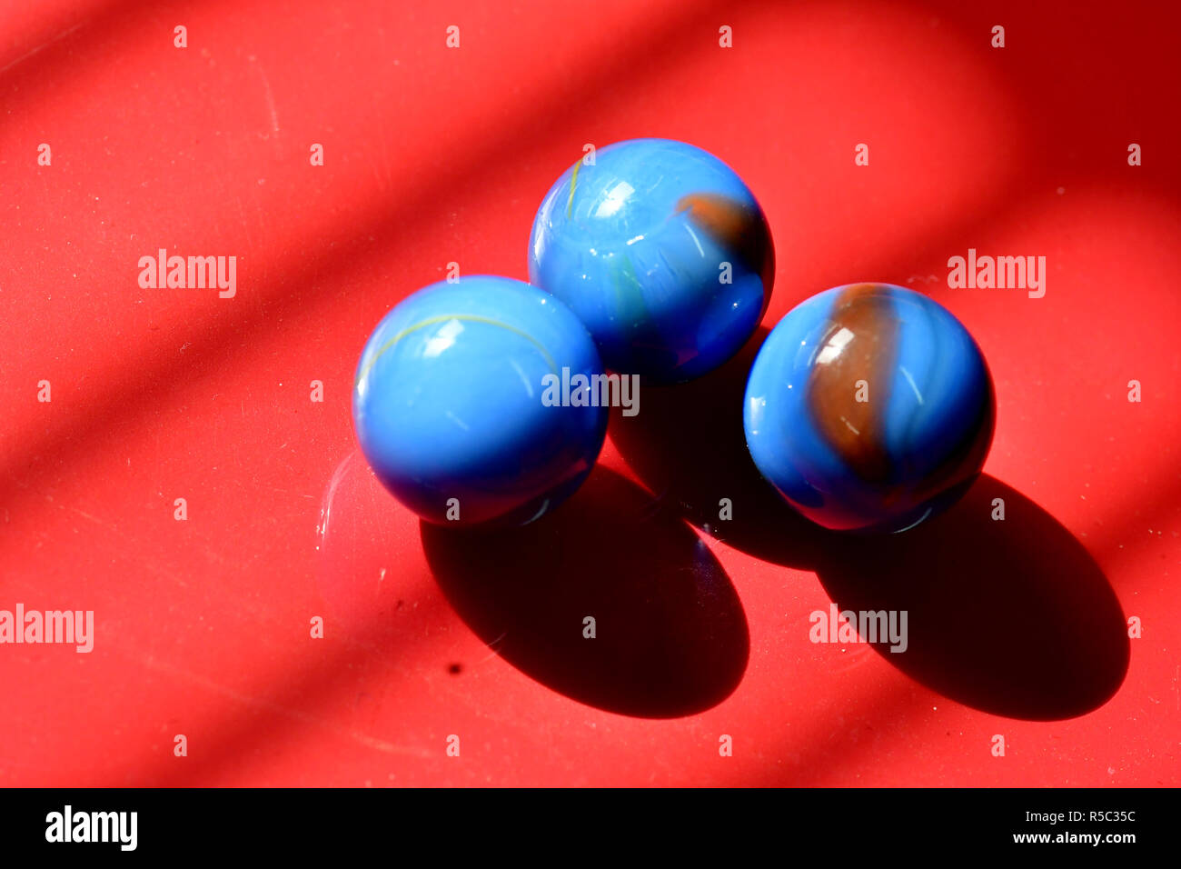 Marbles at close up photo with reflections and shadows Stock Photo - Alamy