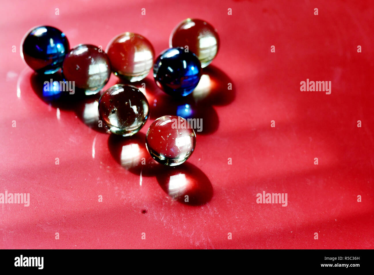 Marbles at close up photo with reflections and shadows Stock Photo - Alamy