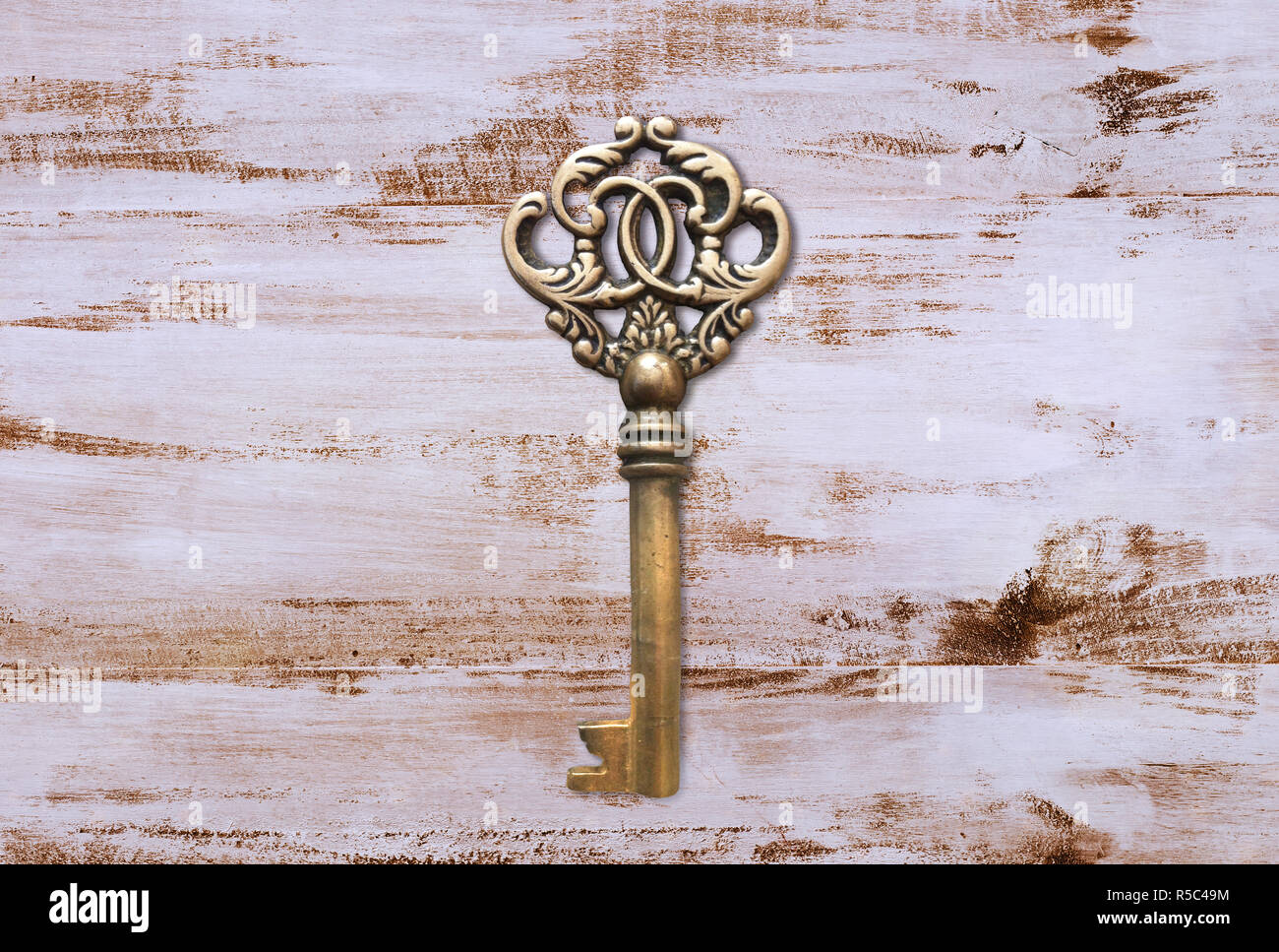 Vintage key on linen fabric. Crown shaped chest key Stock Photo - Alamy