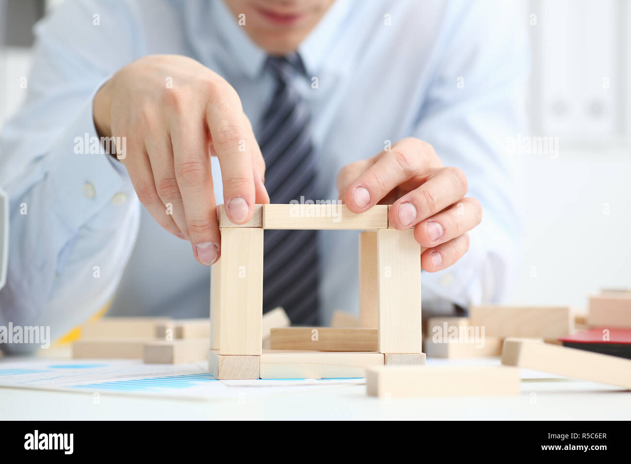 Male hand holds the roof to the lock in Stock Photo - Alamy