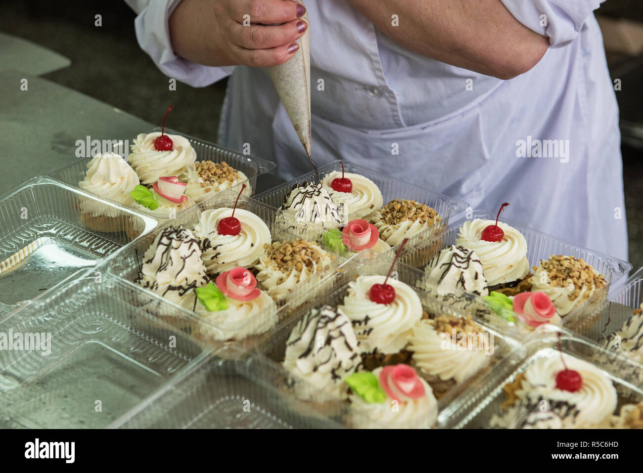 Manual cakes production Stock Photo - Alamy