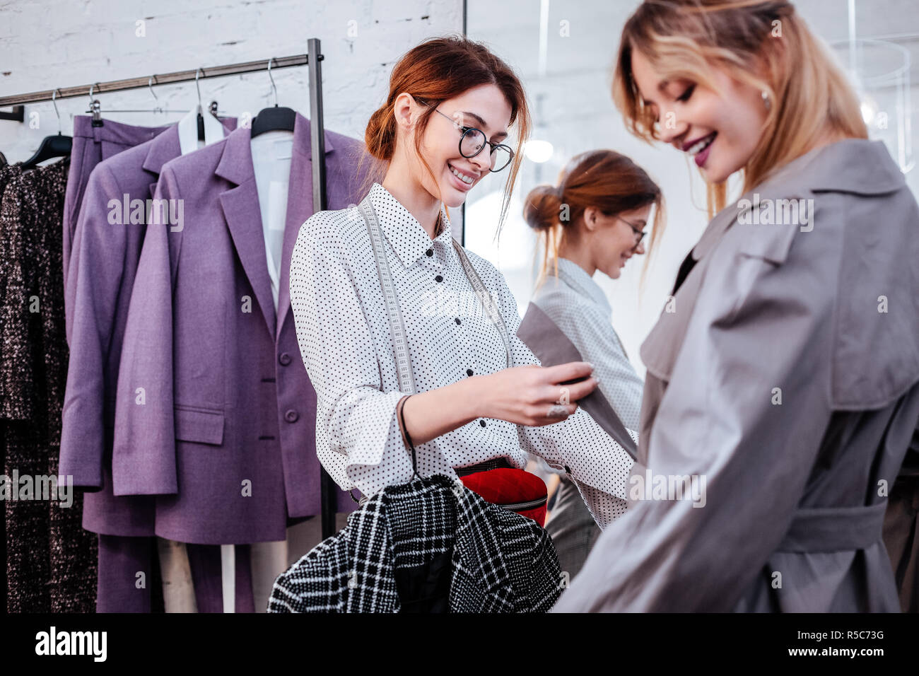 Before fashion show. Famous fashion designer talking to model in new ...