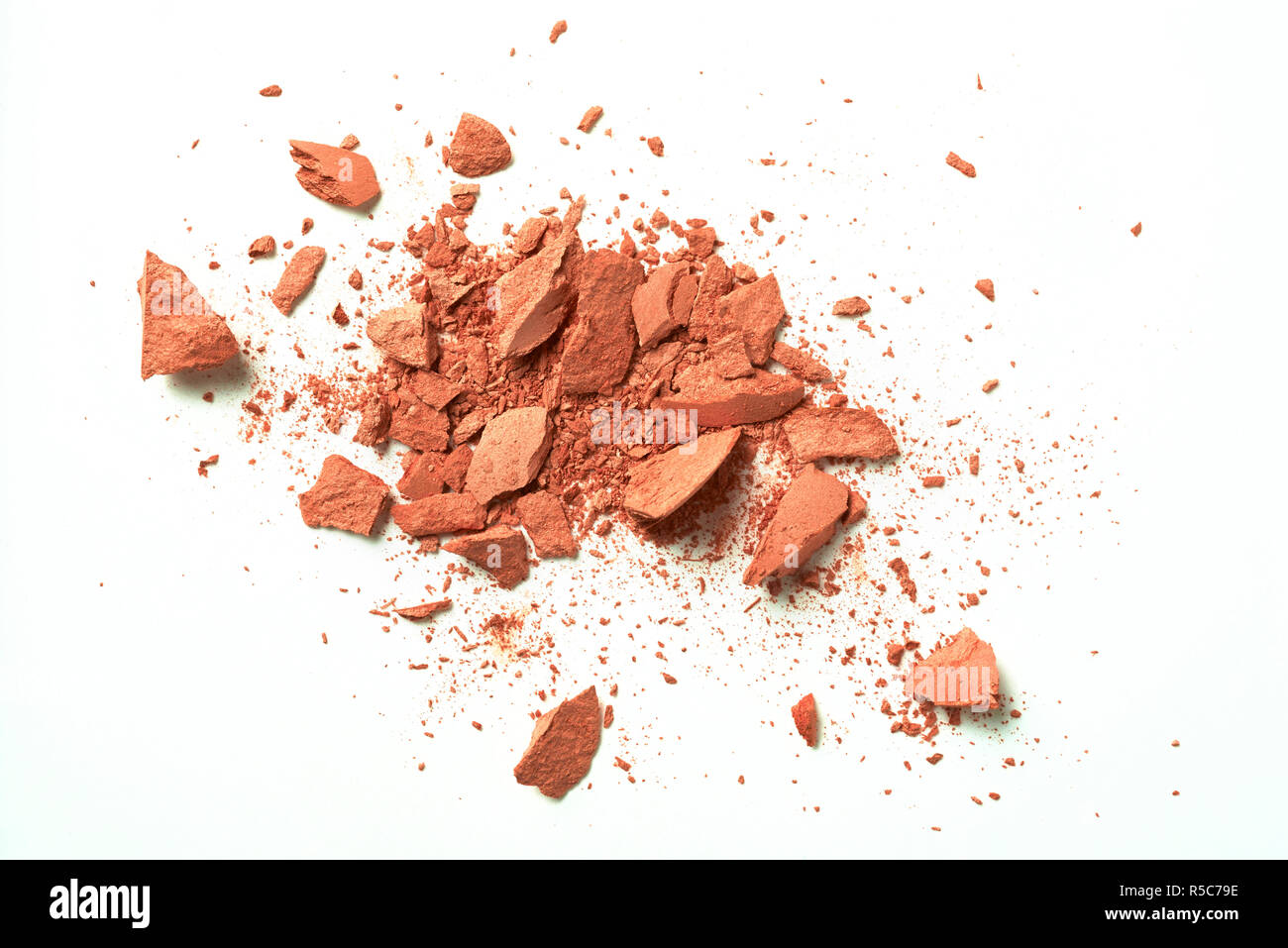 A still life cut out product image of a sample of pink or blush coloured powder makeup on a ...