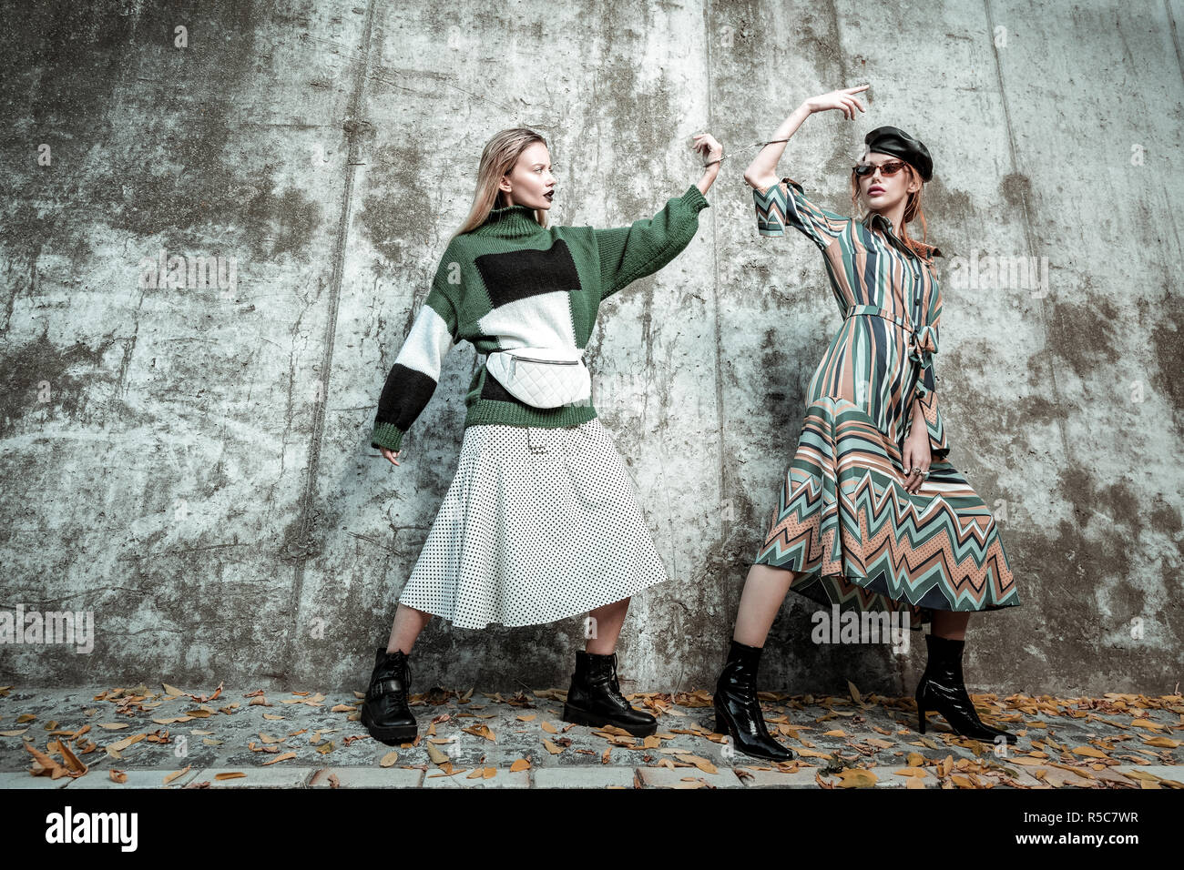 Showing poses. Professional slim trendy photo models showing their ...