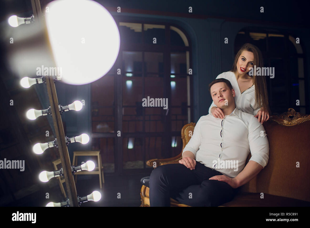 Loving couple filling marriage application form and smiling in home ...