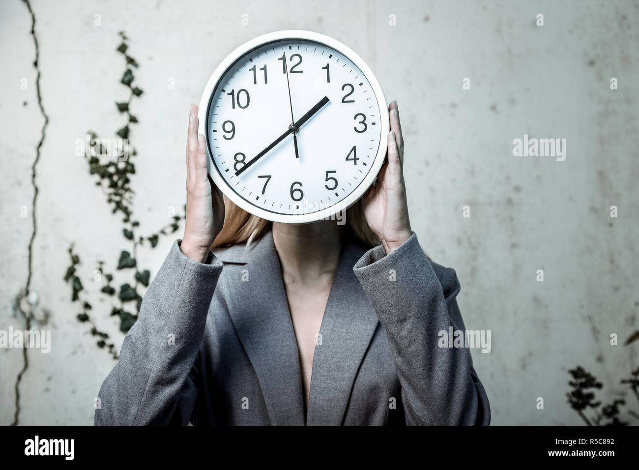 Social advert. Professional blonde-haired photo model holding clock ...