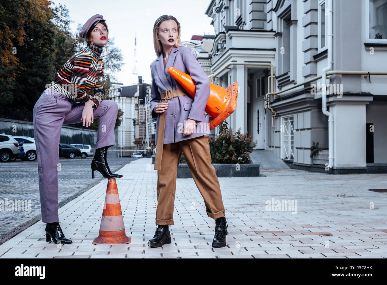 Promoting collection. Two experienced professional photo models wearing ...