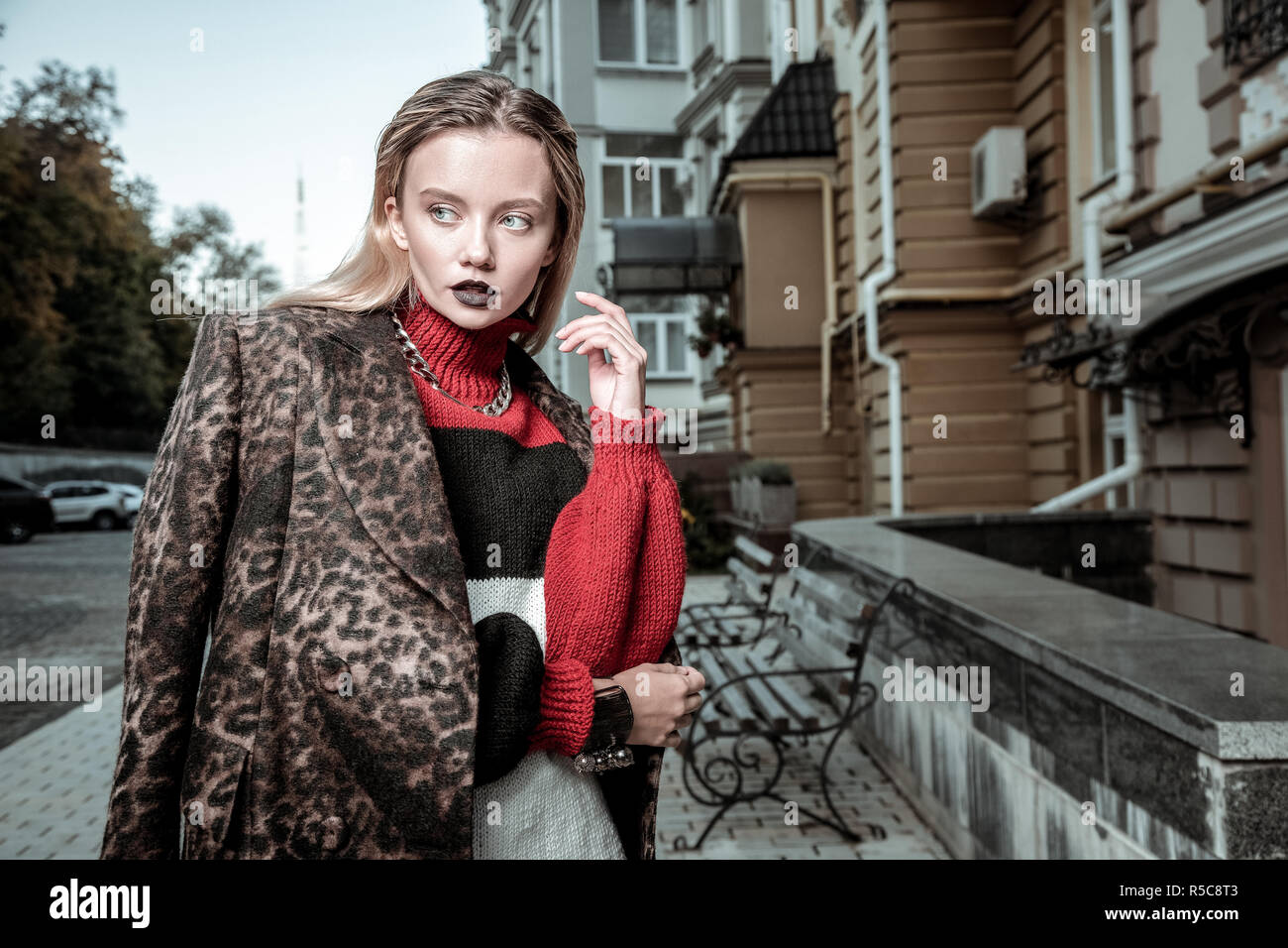 New clothes. Professional model posing for the photographer wearing ...