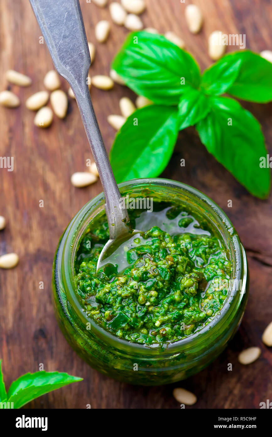 pesto sauce in a glass jar. selective focus Stock Photo - Alamy