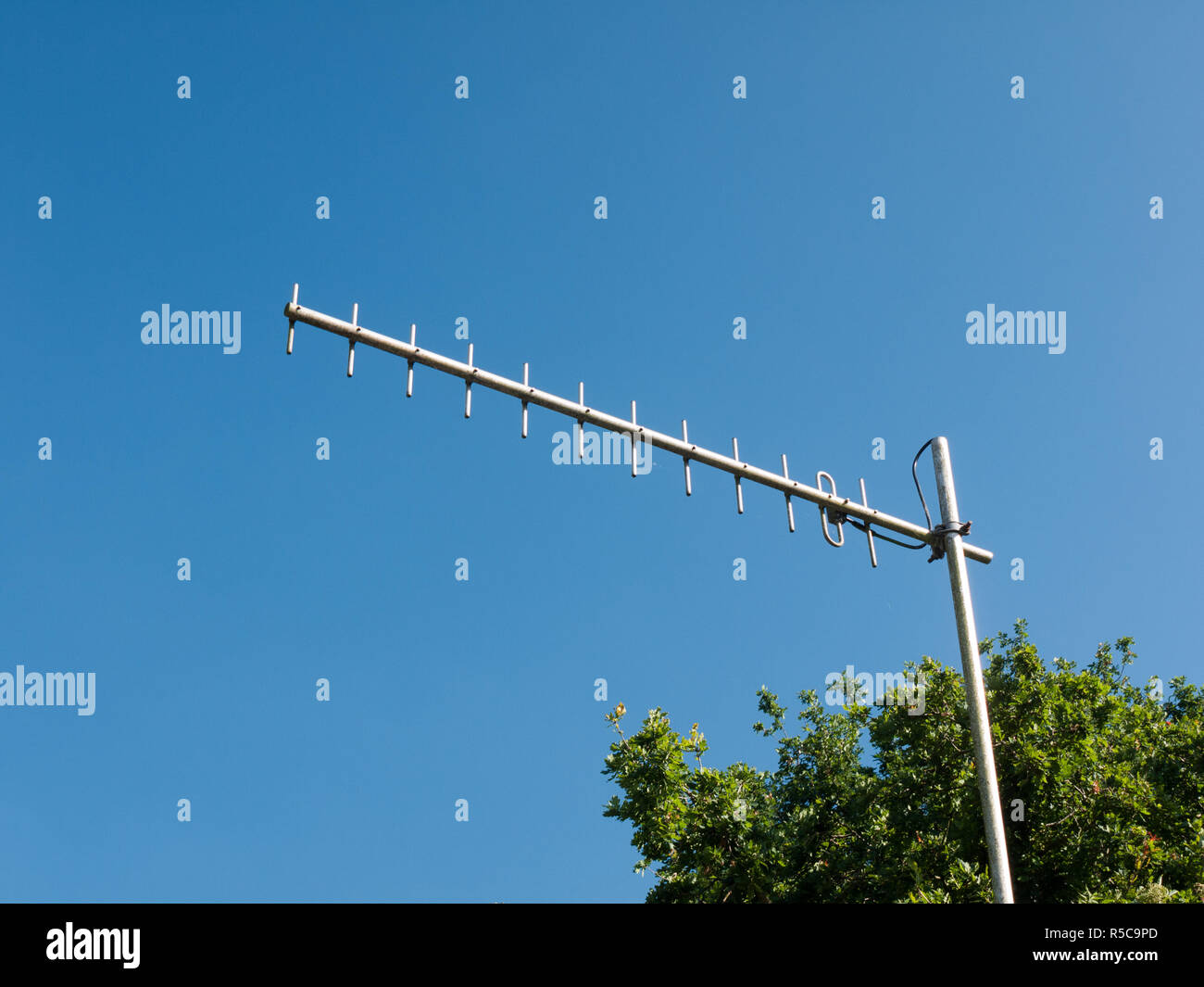 metal aerial outside above clear sky tree Stock Photo - Alamy