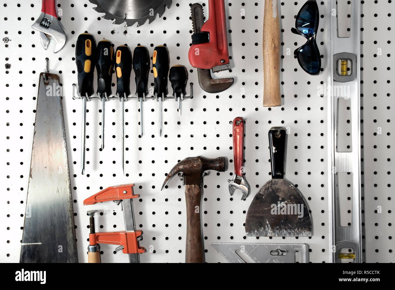 Tools organized in garage Stock Photo - Alamy