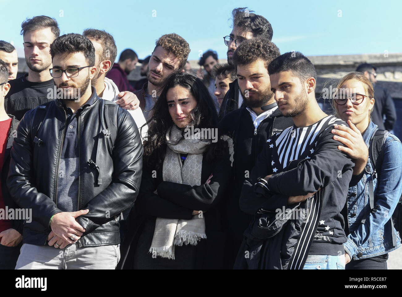 Students and friends of 21 year old Davide Natale, who died yesterday ...