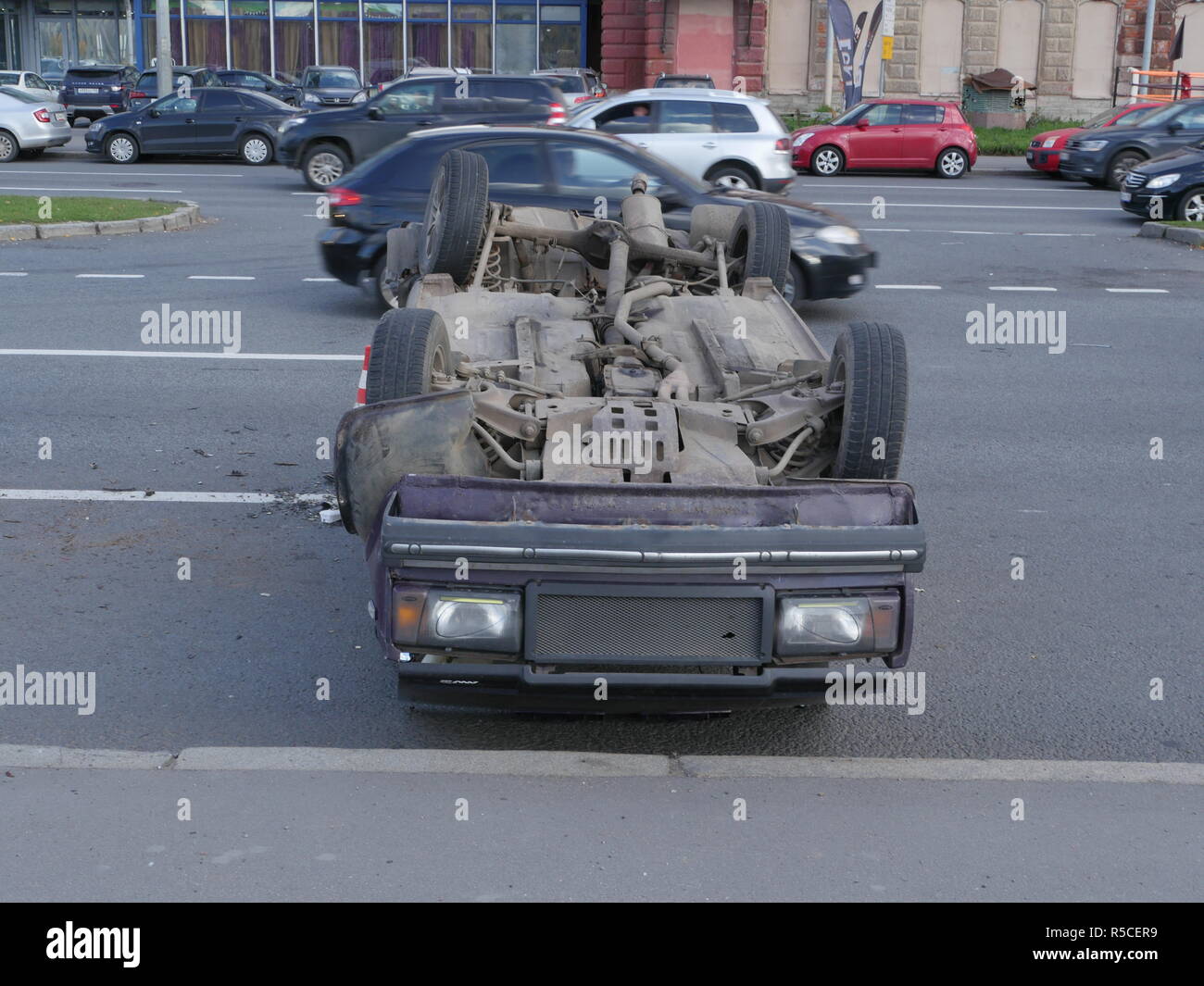 Accident, overturned car on the carriageway Stock Photo - Alamy