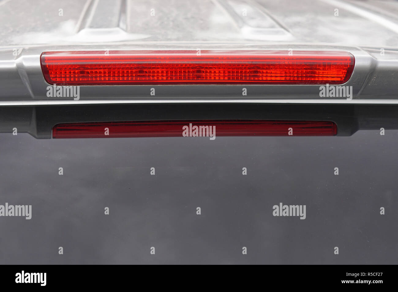 Third brake red light at vehicle rear end Stock Photo - Alamy