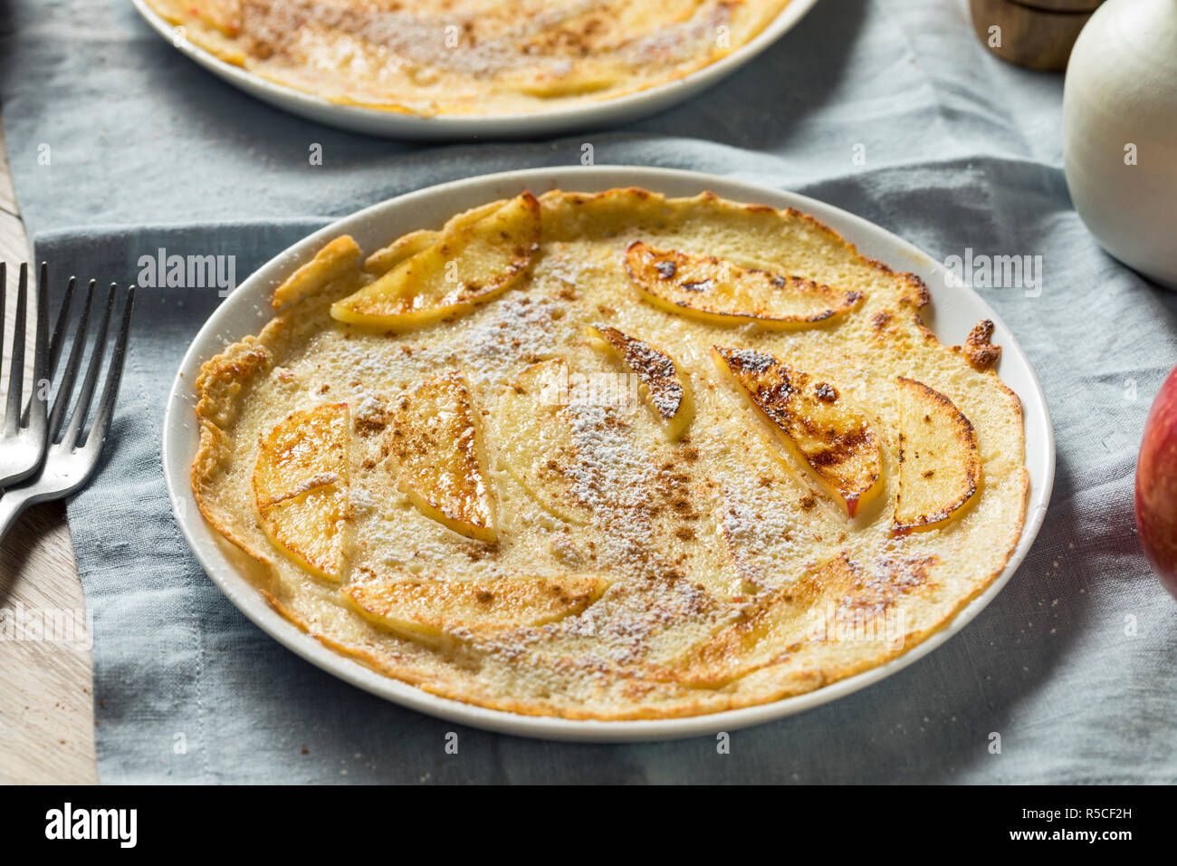 Homemade Apple Dutch Pannekoek Pancake with Powdered Sugar Stock Photo ...