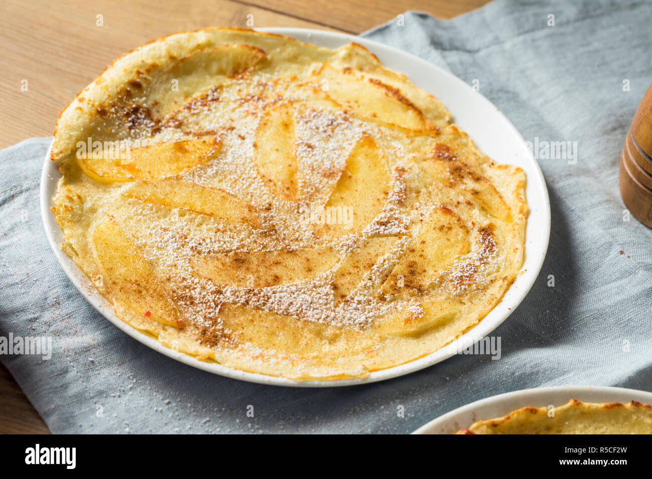 Homemade Apple Dutch Pannekoek Pancake with Powdered Sugar Stock Photo ...