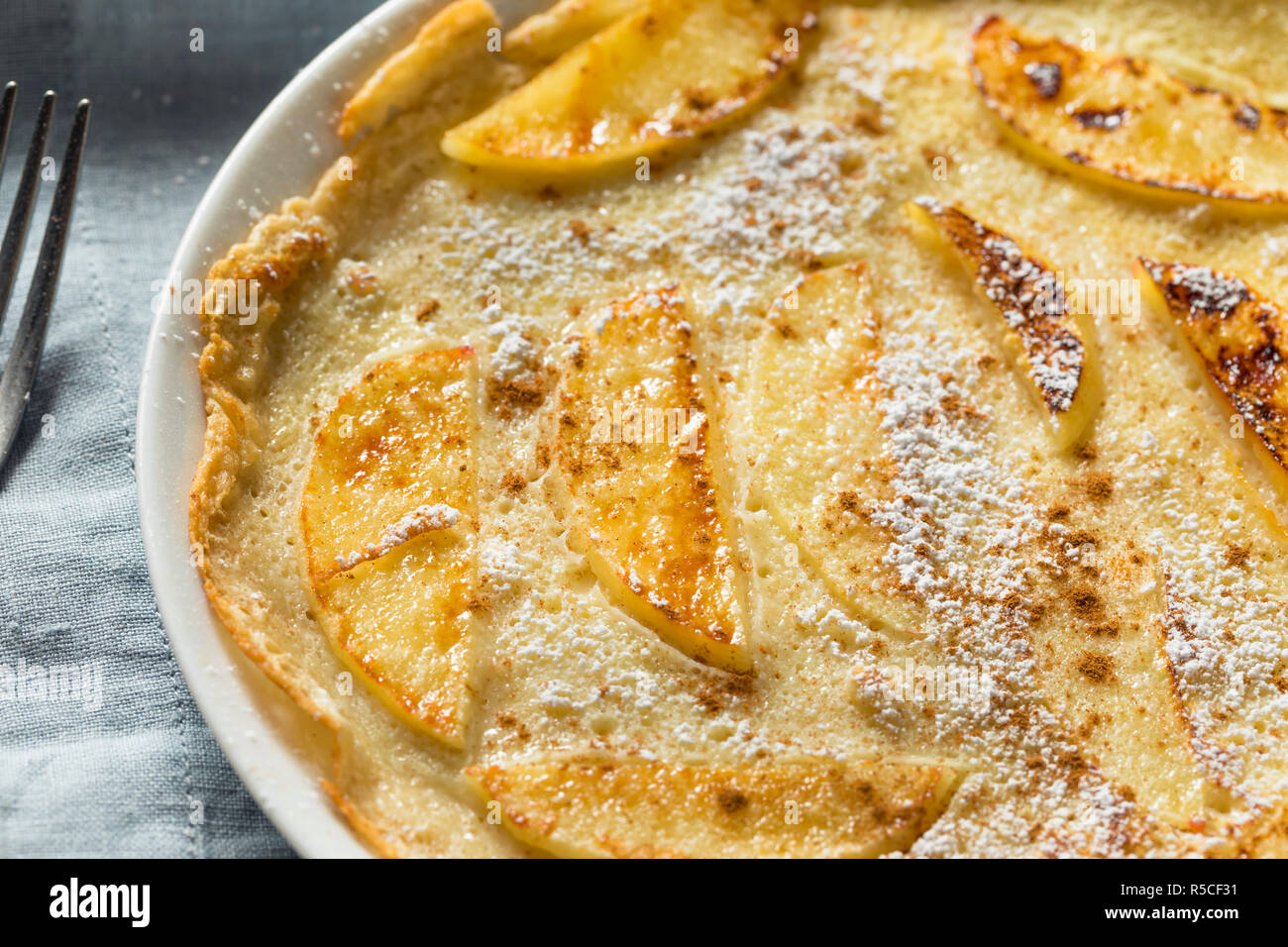 Homemade Apple Dutch Pannekoek Pancake with Powdered Sugar Stock Photo ...