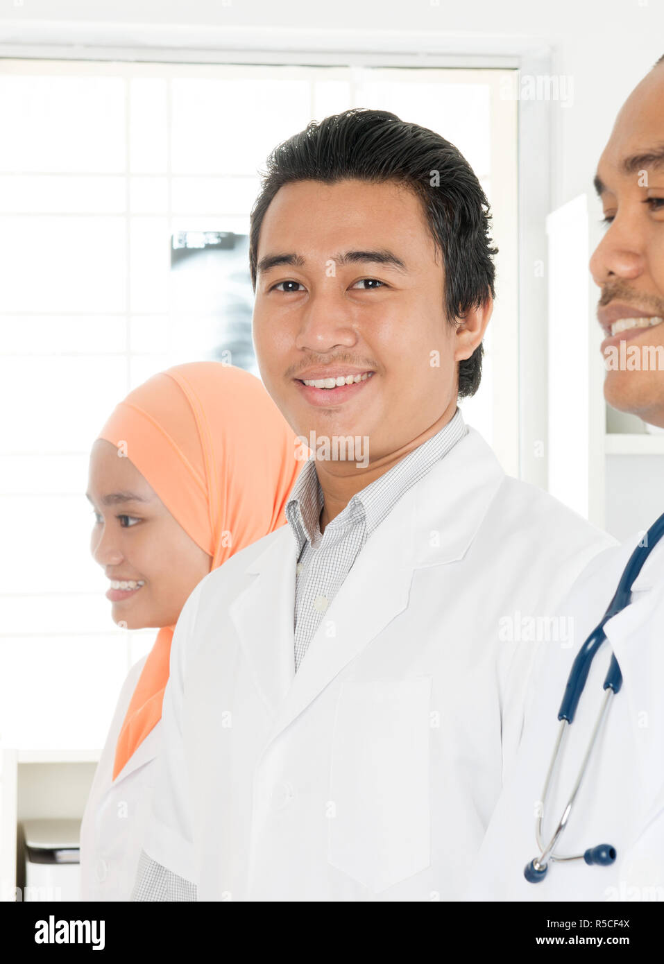 Happy Asian medical team Stock Photo - Alamy