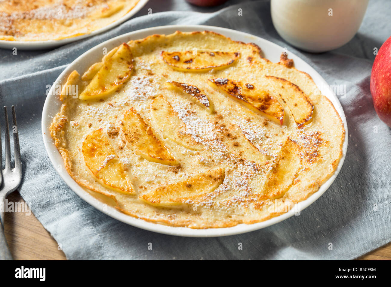 Homemade Apple Dutch Pannekoek Pancake with Powdered Sugar Stock Photo ...