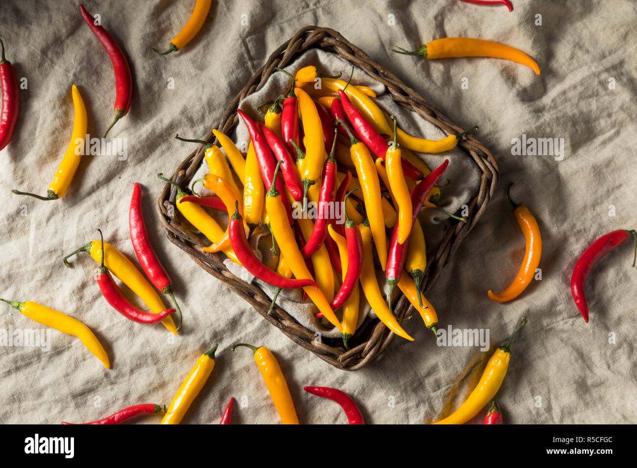Organic Assorted Spicy Hot Peppers in a Basket Stock Photo - Alamy