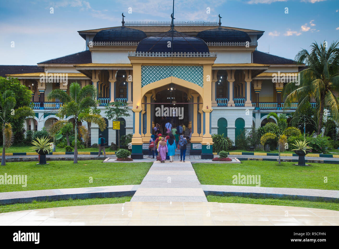 Indonesia, Sumatra, Medan, People entering Maimoon Palace Stock Photo ...