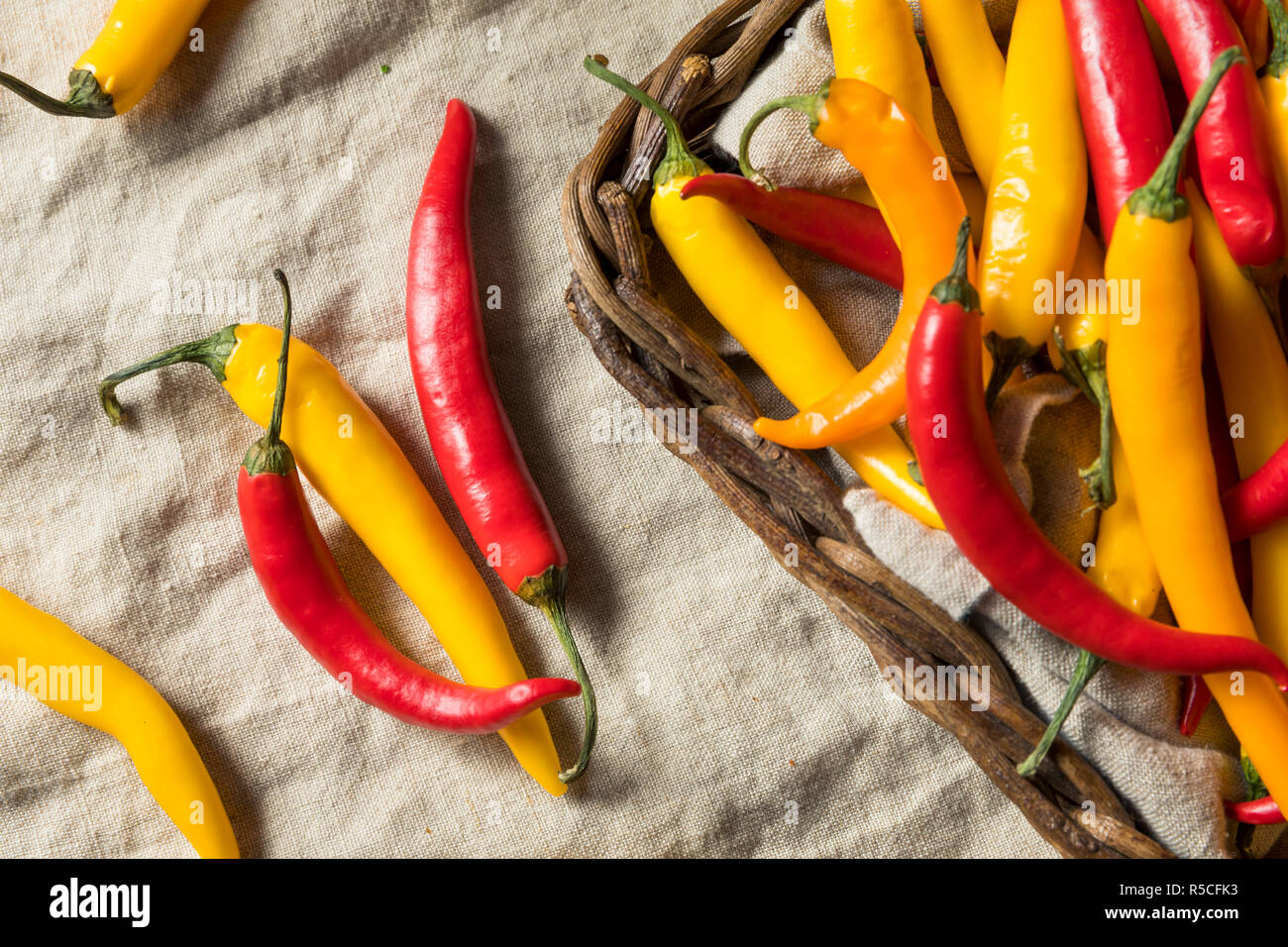 Organic Assorted Spicy Hot Peppers in a Basket Stock Photo - Alamy