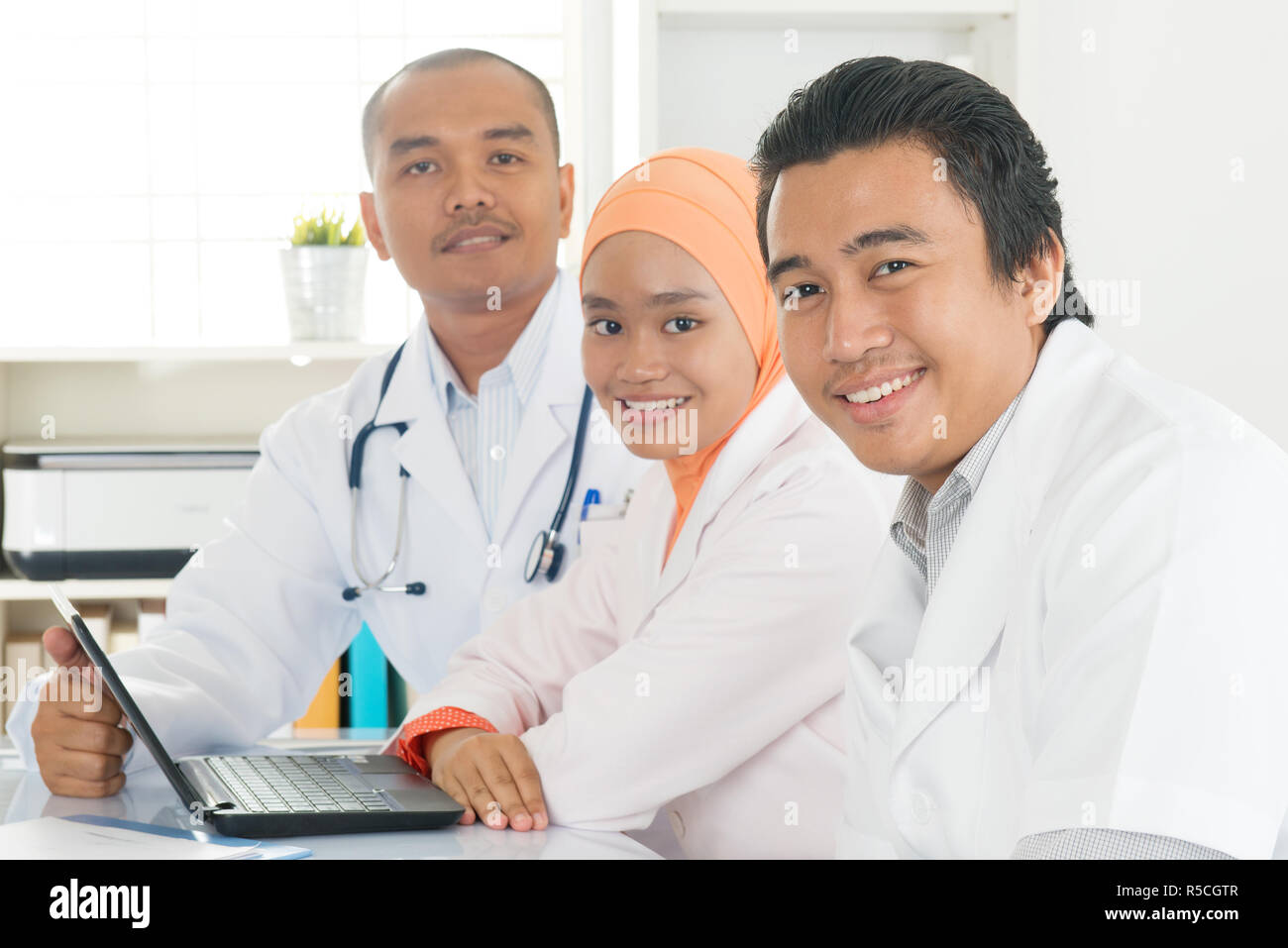 Medical team working together at hospital office Stock Photo - Alamy
