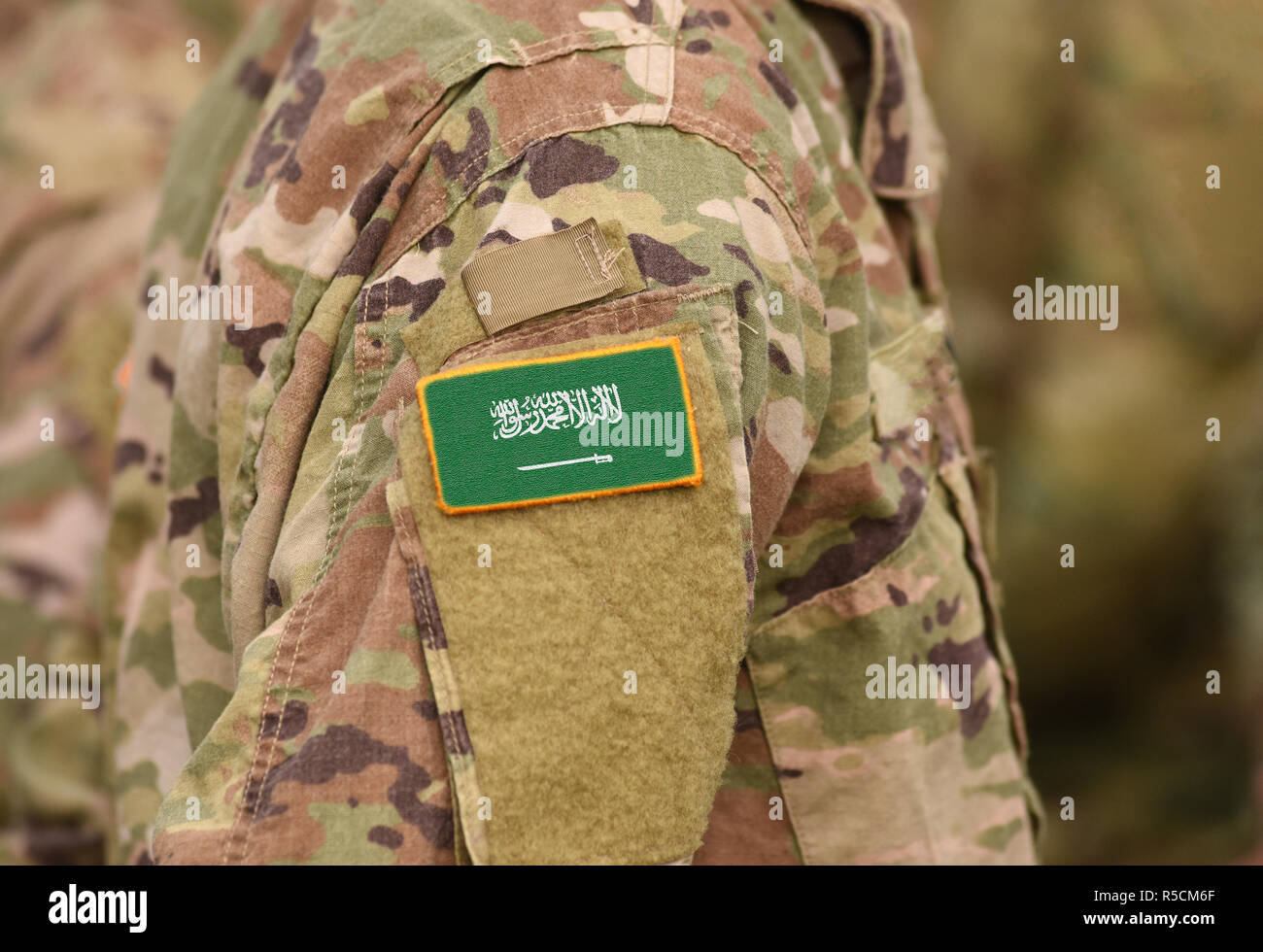 Flag of Saudi Arabia on soldiers arm (collage Stock Photo - Alamy