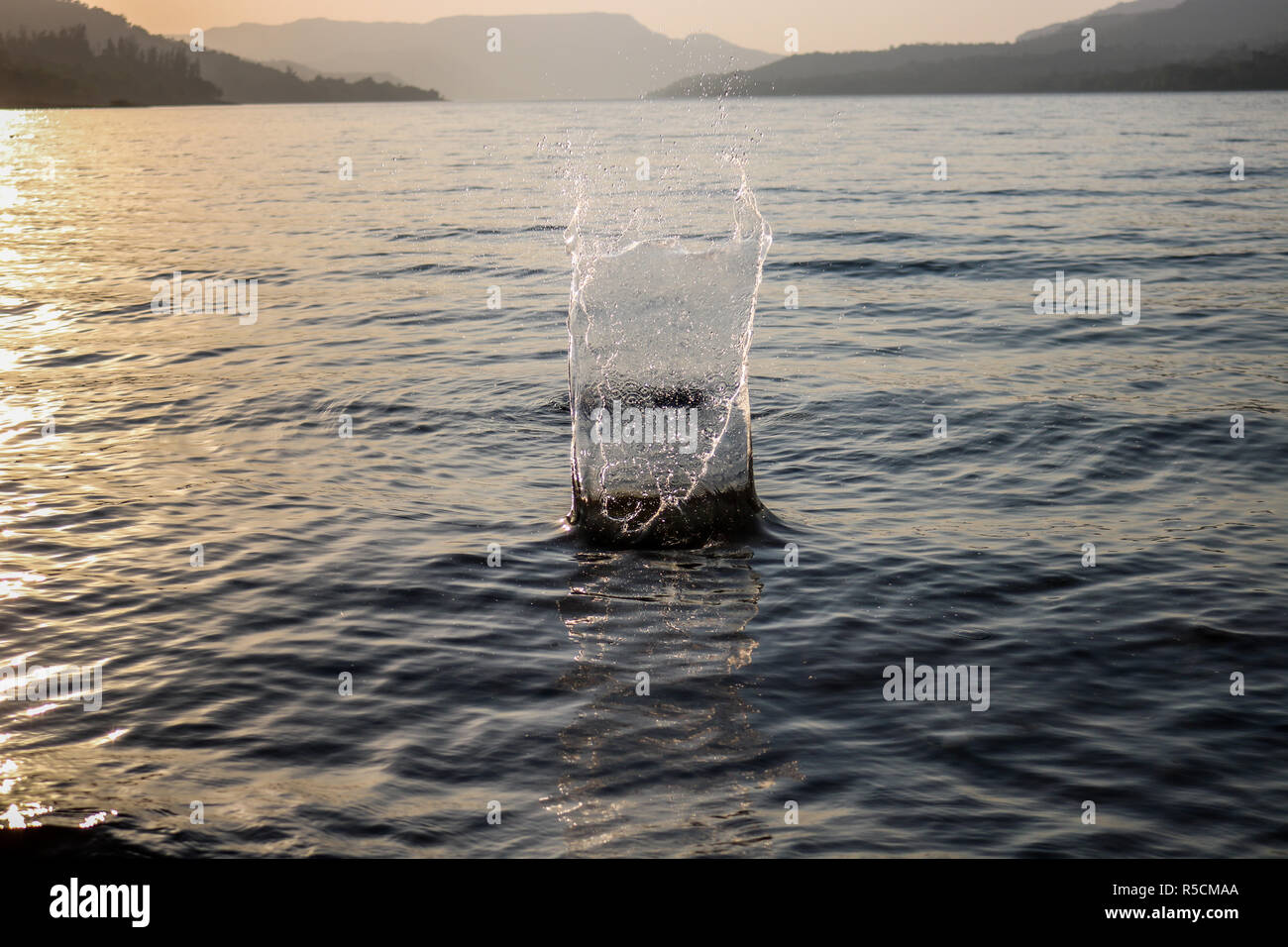 Water drop in the lake Stock Photo - Alamy