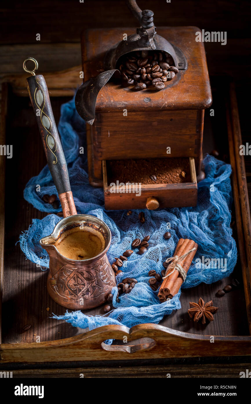 Fresh coffee with pot boiled coffee and beans on blue Stock Photo - Alamy