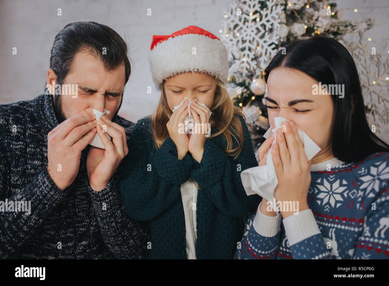 Family is sick at Christmas They have handkerchief. Sick people have ...