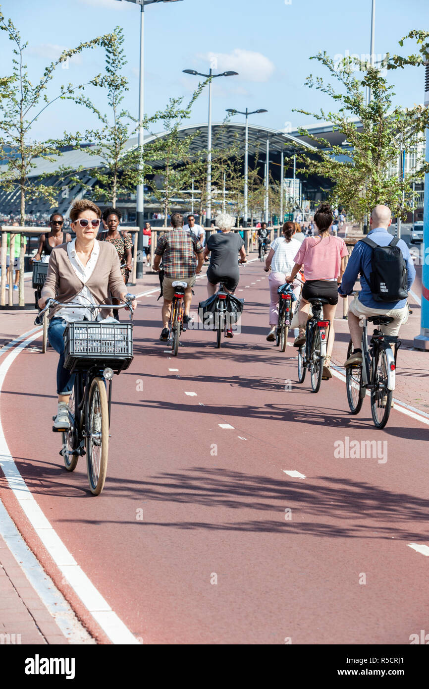 Amsterdam, The Netherlands. Commuters Using Bicycle Lane for Riding ...