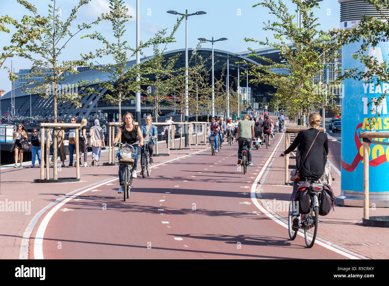 Amsterdam, The Netherlands. Commuters Using Bicycle Lane for Riding ...