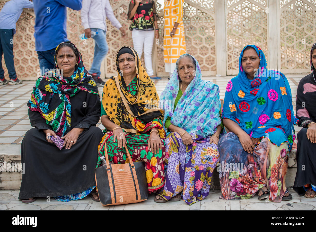 A group of women sitting on a step inside Agra Fort, Uttar Pradesh ...