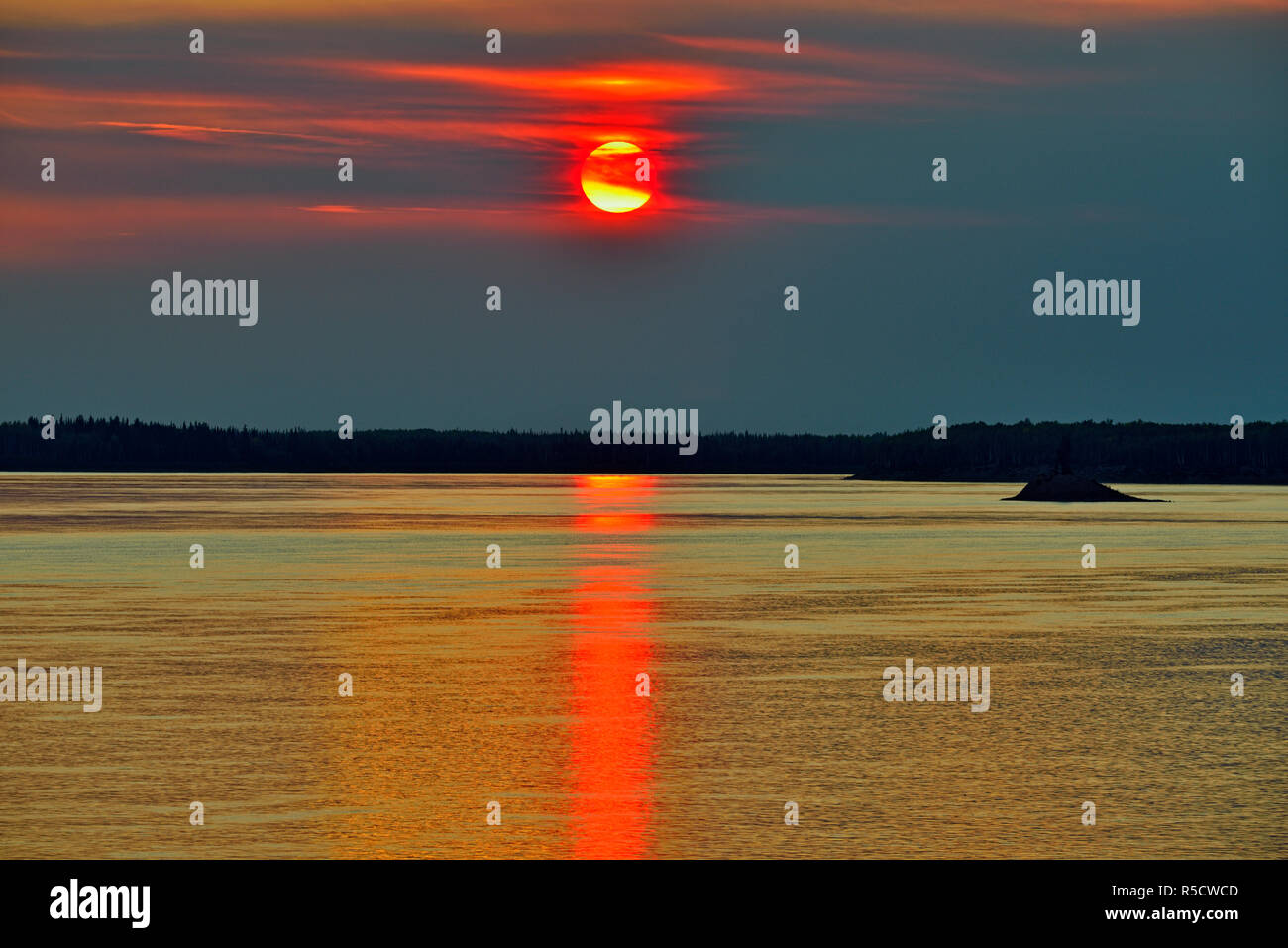Sunset through forest fire haze over the MacKenzie River, Fort ...