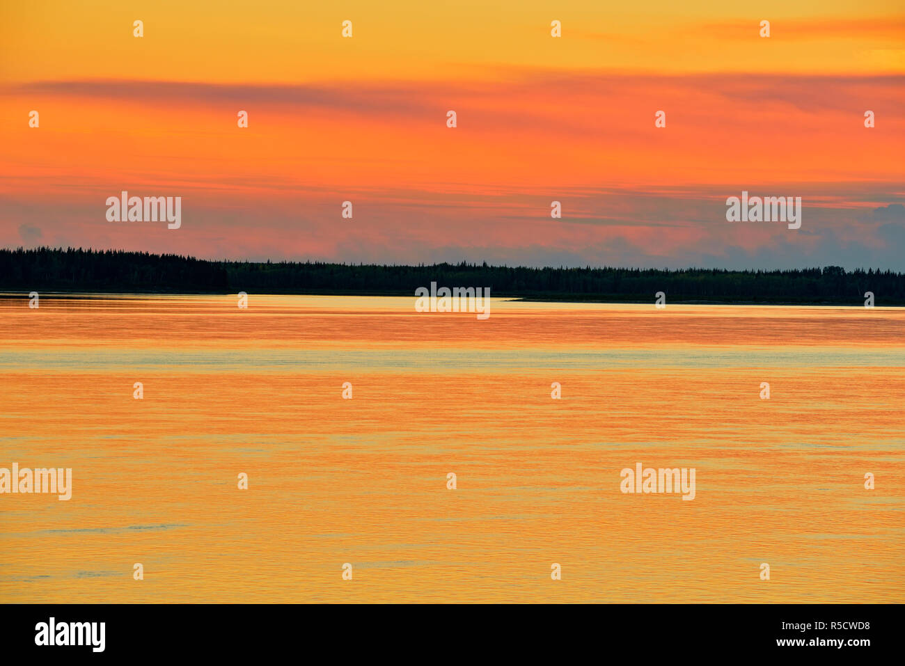 Sunset through forest fire haze over the MacKenzie River, Fort ...