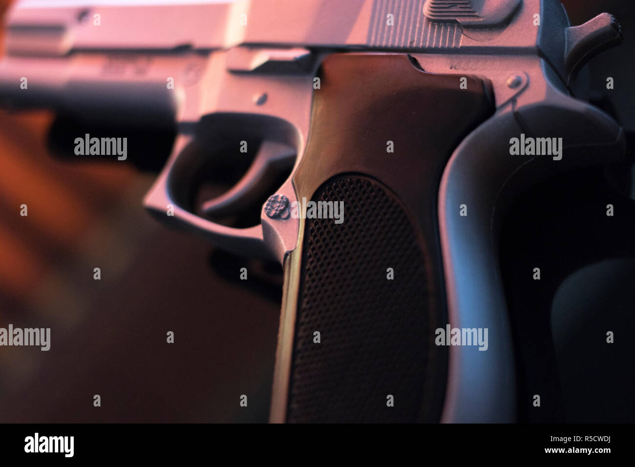 Pistol automatic handgun weapon on table in hotel bedroom in ...