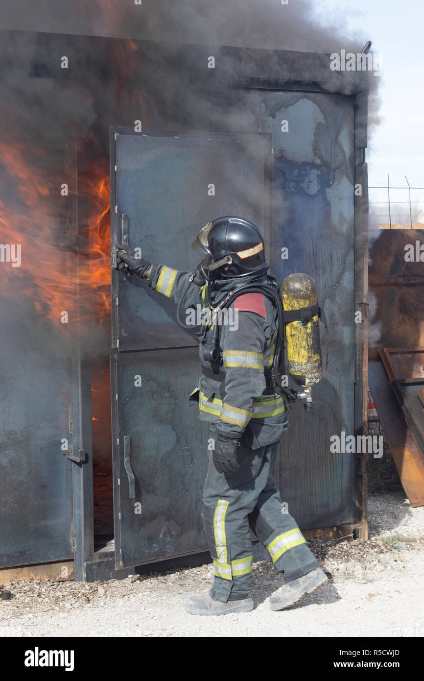 Firefighter putting out fire training station extinguisher backdraft ...