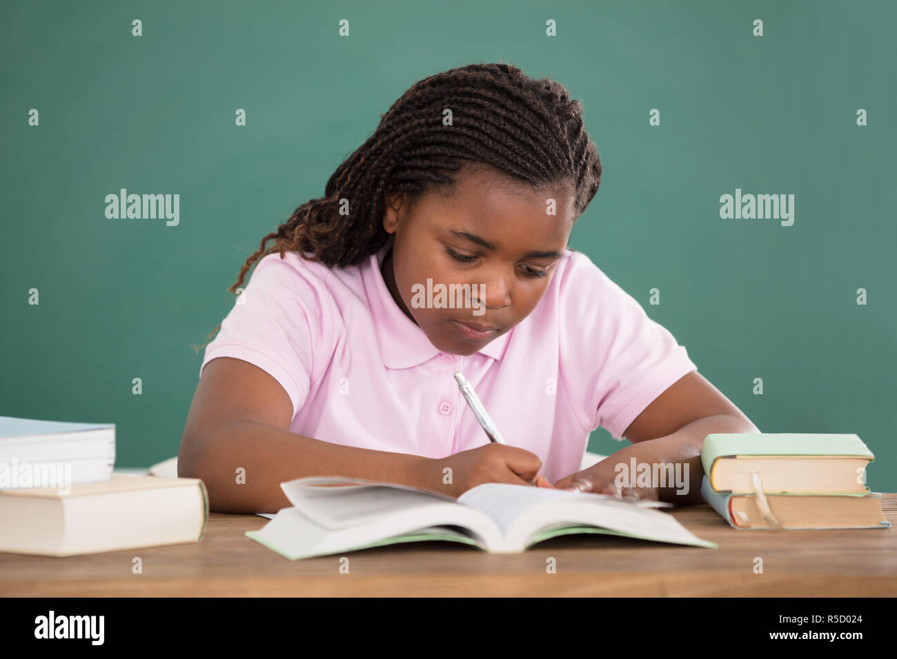 Girl Studying In Class Stock Photo - Alamy