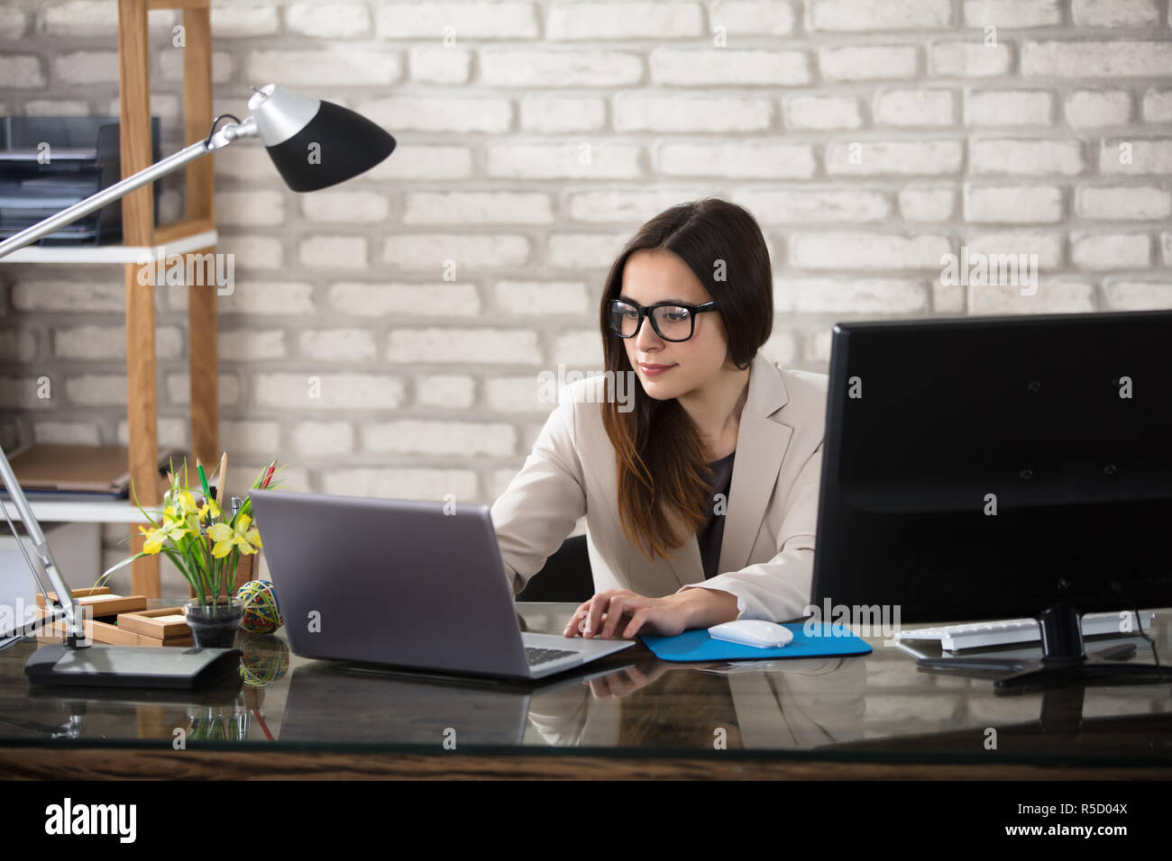 Smiling Businesswoman Using Computer Stock Photo - Alamy