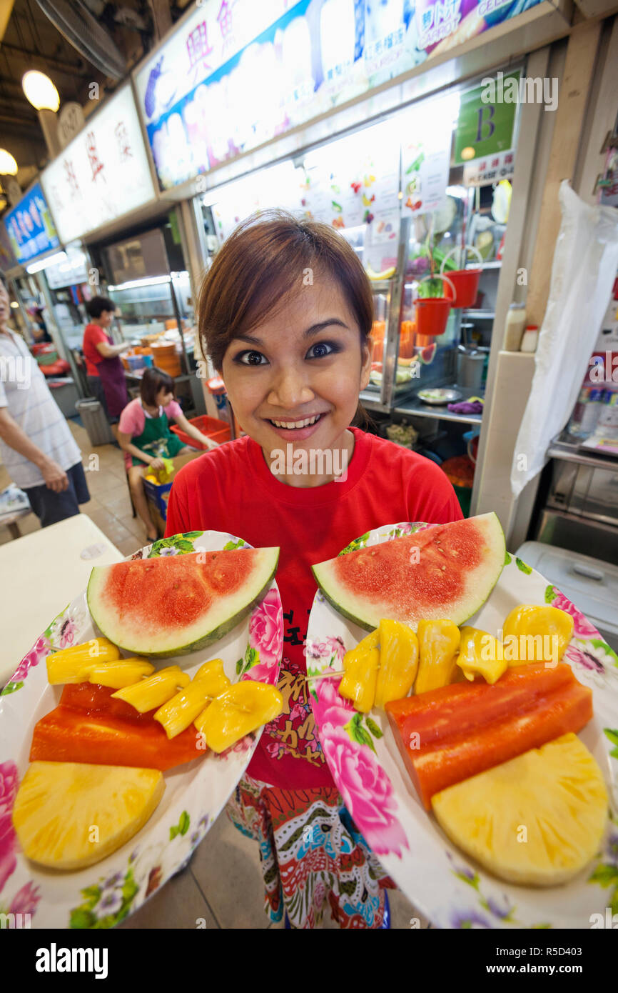 Singapore, Waitress Serving Fruit in Typical Hawker Center Food Court ...