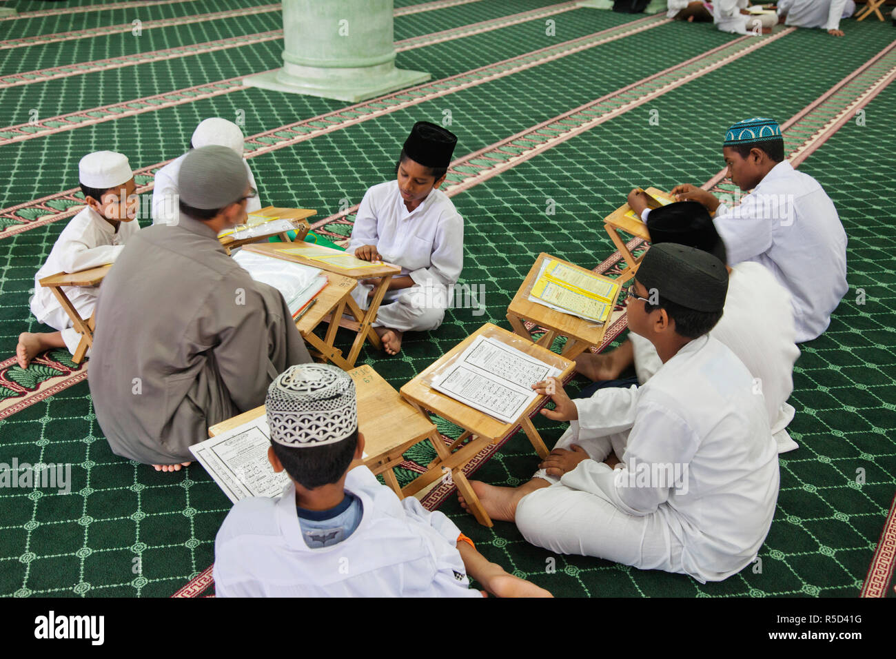 Singapore, Jamae (Chulia) Mosque, Children Studying the Koran Stock ...
