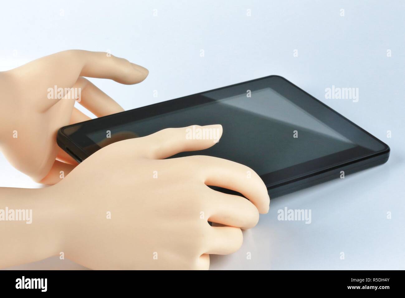 Hands holding a modern wireless PDA device Stock Photo - Alamy