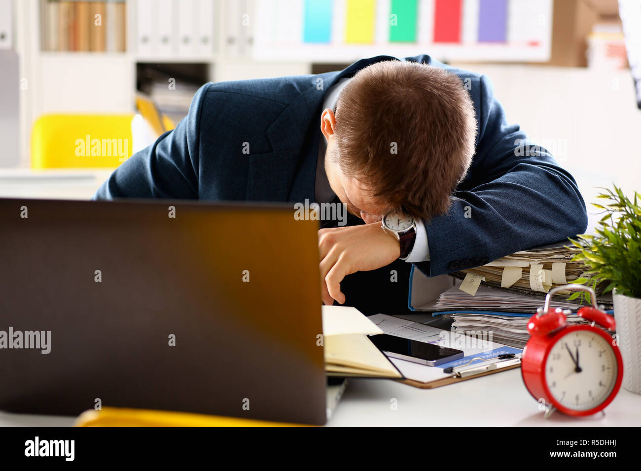 Red alarm clock shows late time closeup Stock Photo - Alamy