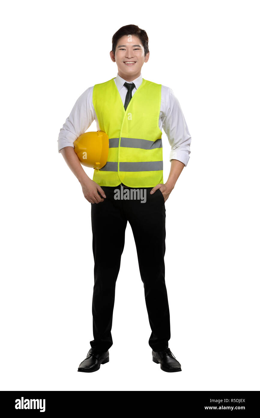 Asian worker wearing safety vest and yellow helmet Stock Photo - Alamy