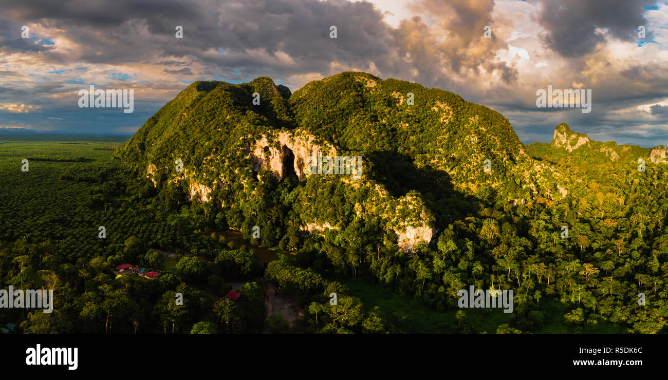 Magnificent aerial view of a limestone mountain with massive cave ...