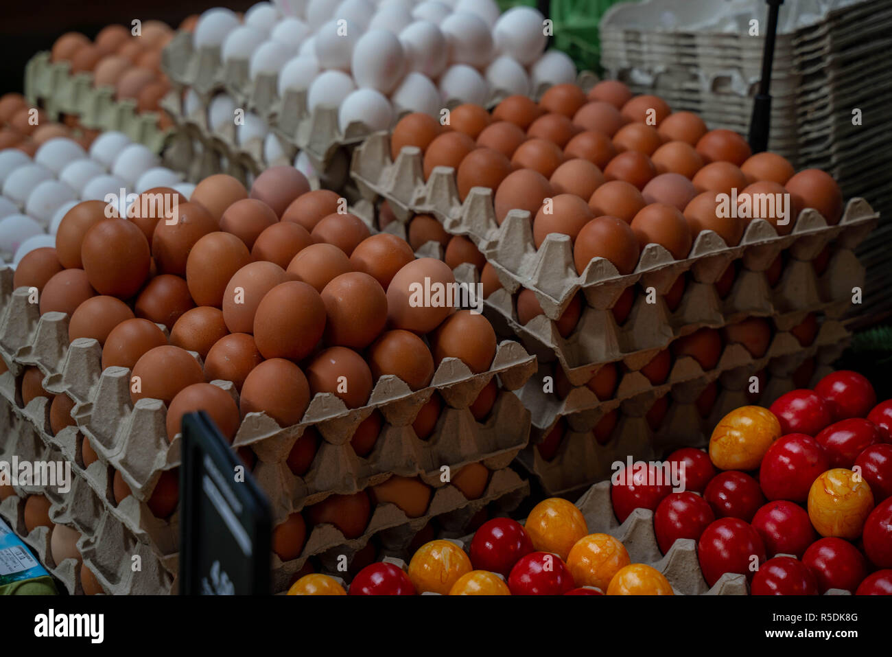 Chicken eggs with while eggshell in a cardboard packaging. Heap of ...