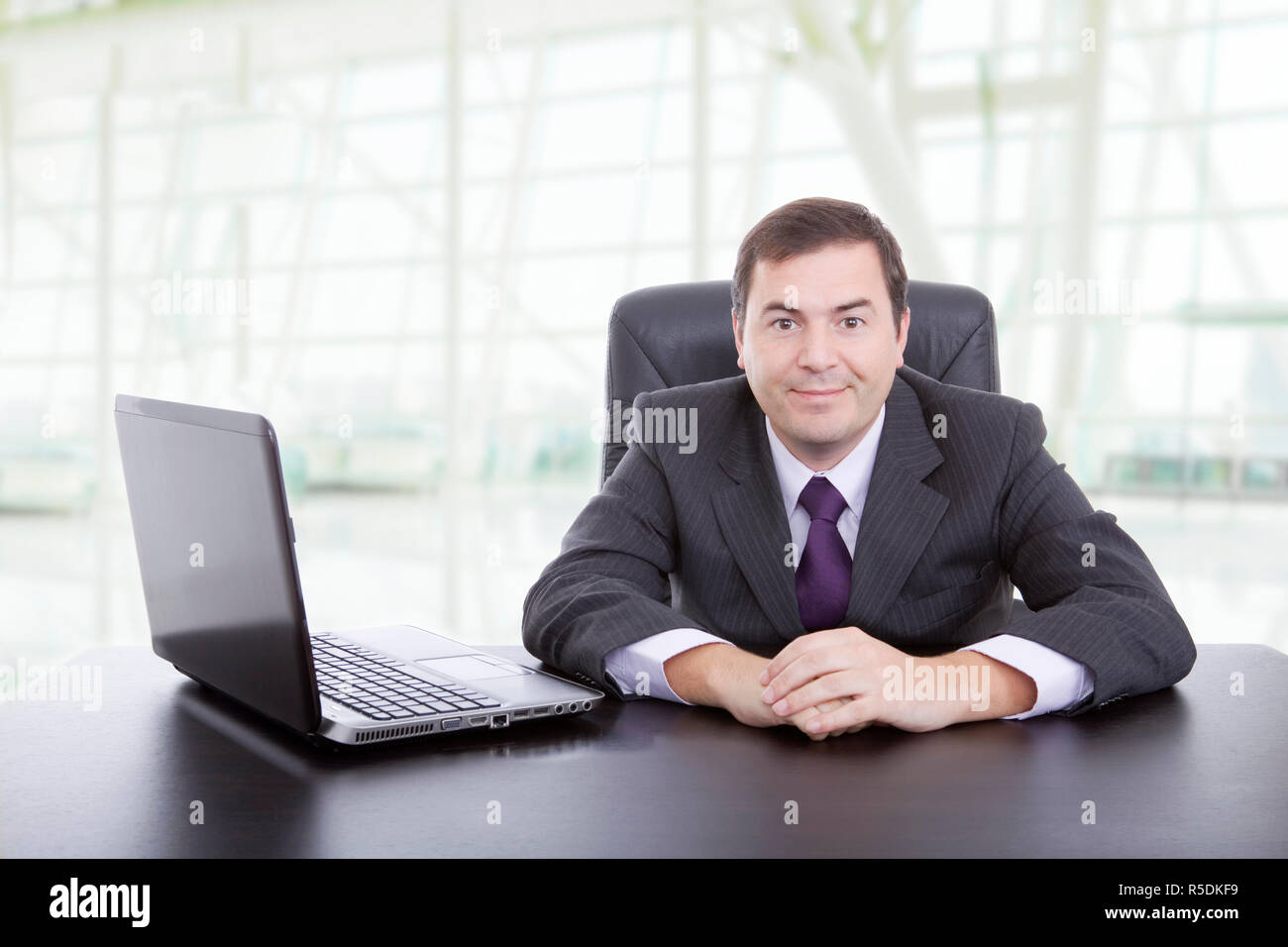 business man working with is laptop, at the office Stock Photo - Alamy