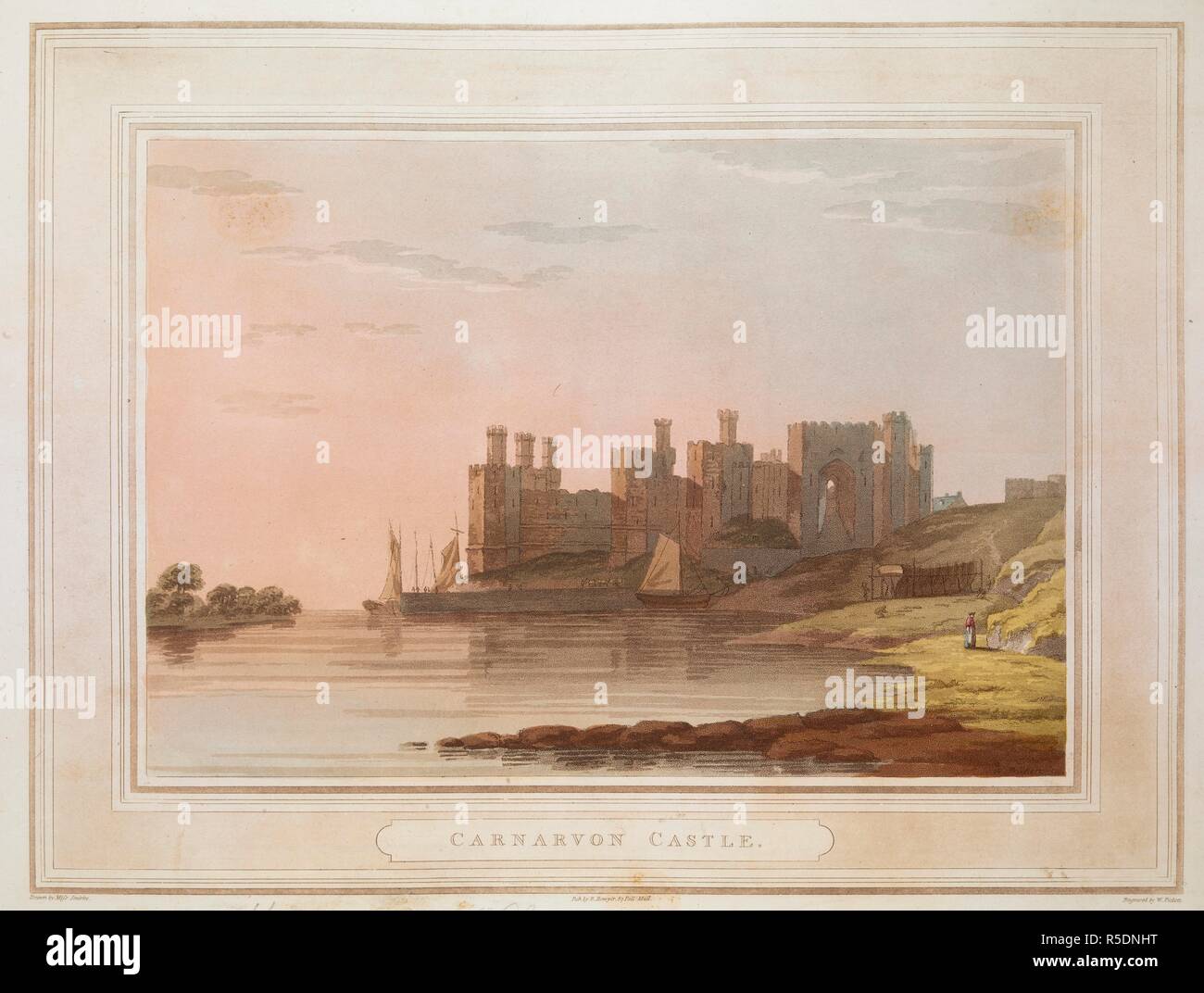 A view of Caernarfon Castle from around the bay with the hull of a ship ...
