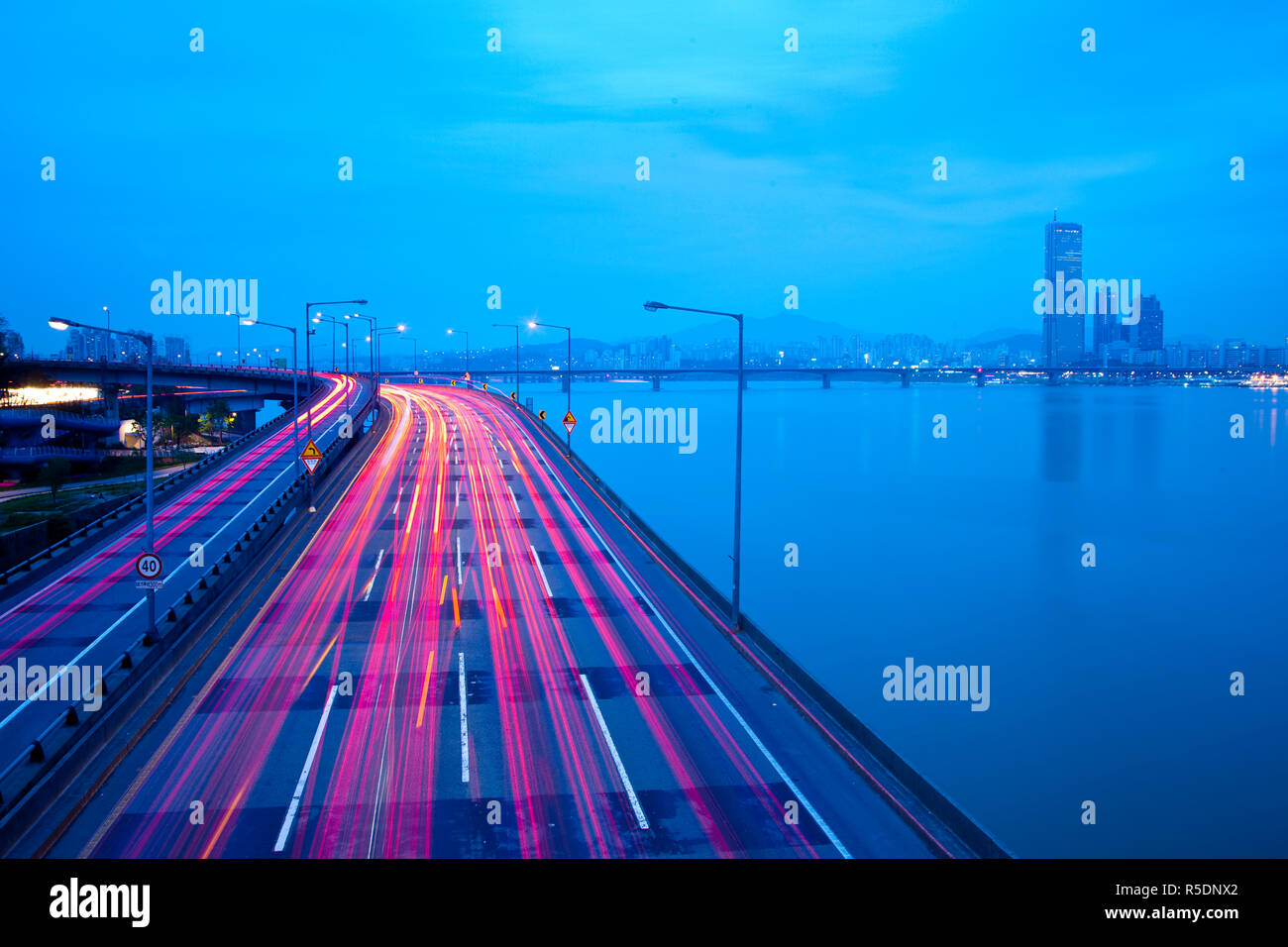 Korea, Seoul, Traffic on Expressway & Hanang River and 63 building on ...